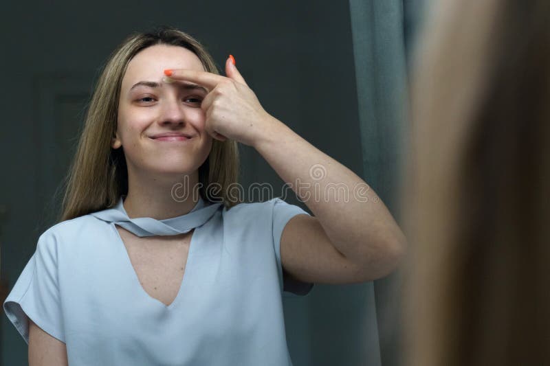 A Young Happy Woman Takes Care Of Her Face In The Morning Stock Image