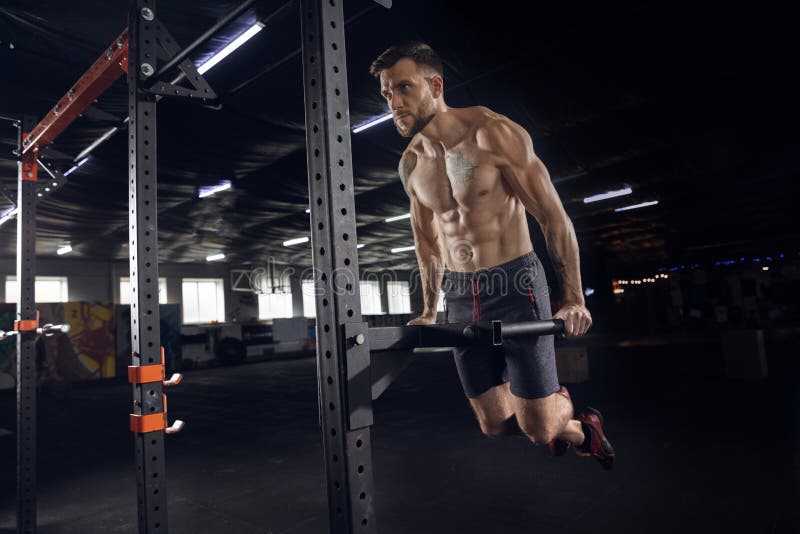Young Healthy Male Athlete Doing Exercises in the Gym Stock Image ...