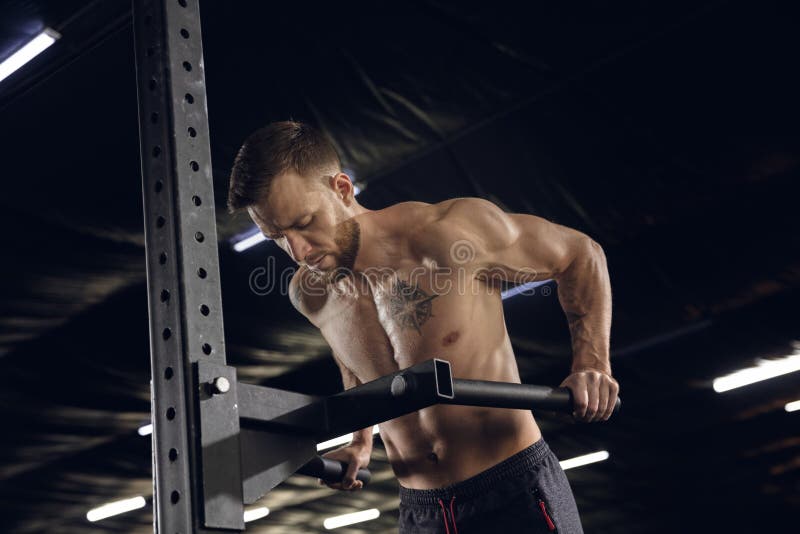 Young Healthy Male Athlete Doing Exercises in the Gym Stock Image ...