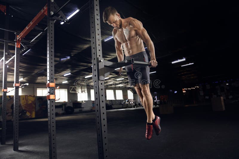 Young Healthy Male Athlete Doing Exercises in the Gym Stock Image ...