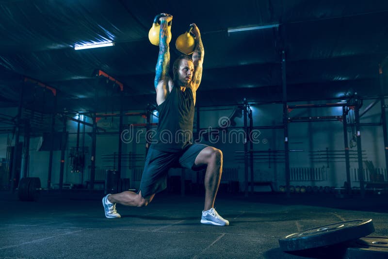 Young Healthy Man Athlete Doing Exercise in the Gym Stock Photo - Image ...