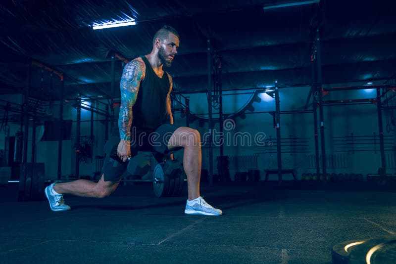 Young Healthy Man Athlete Doing Exercise in the Gym Stock Photo - Image ...