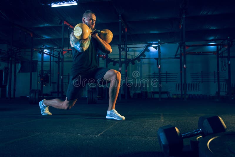 Young Healthy Man Athlete Doing Exercise in the Gym Stock Photo - Image ...