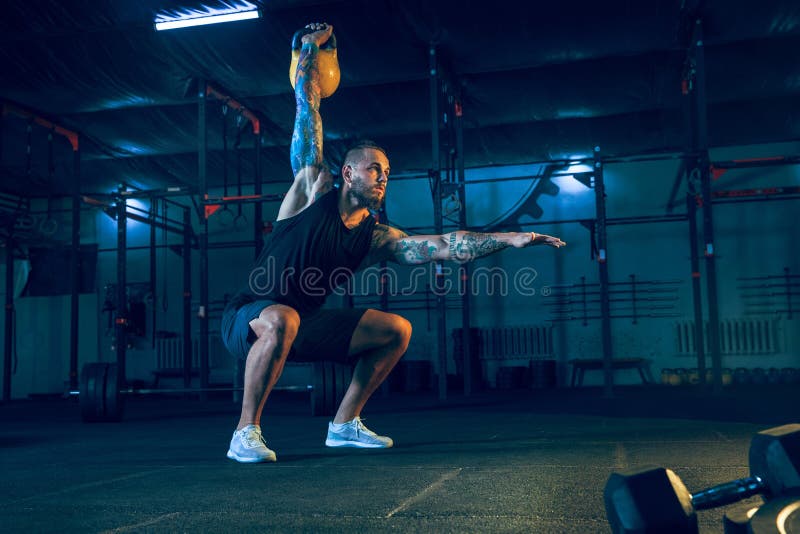 Young Healthy Man Athlete Doing Exercise in the Gym Stock Image - Image ...