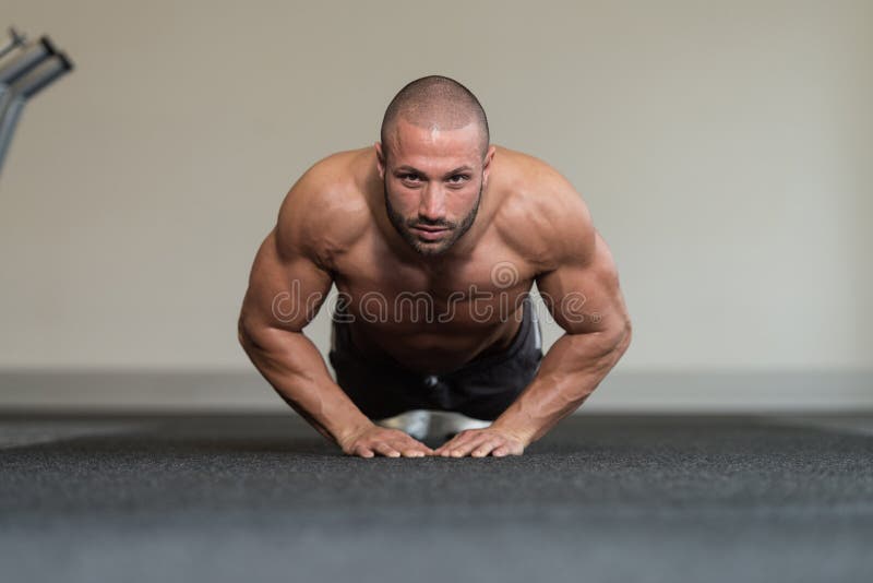 Young Healthy Man Doing Push Ups on Floor Stock Photo - Image of ...