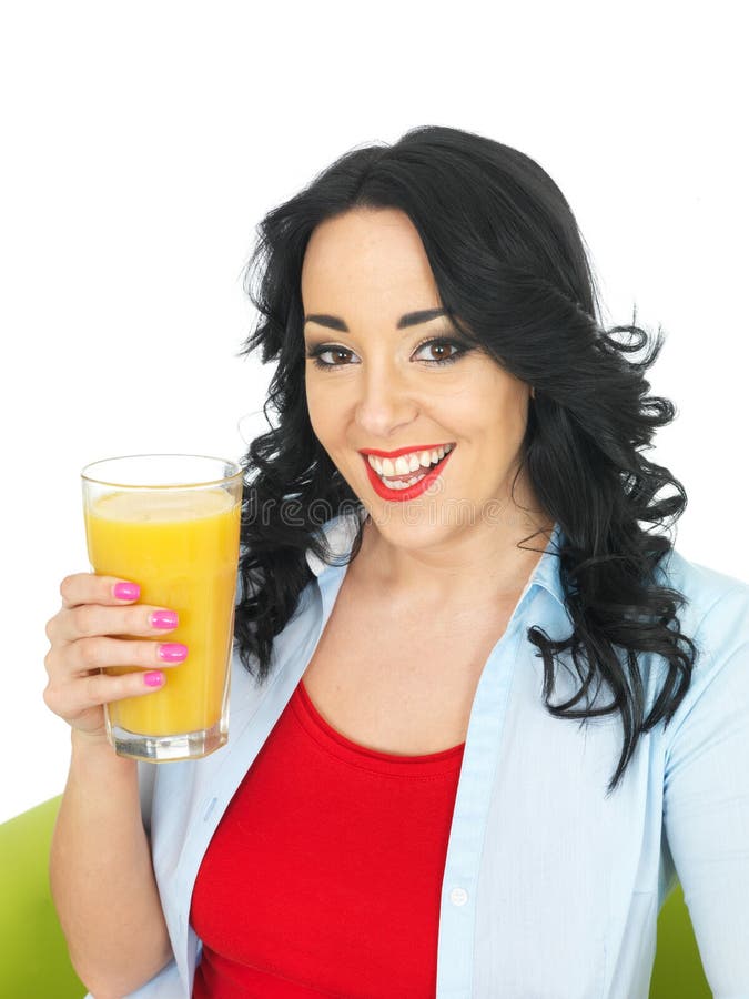 Young Healthy Woman Holding Up A Fresh Glass Of Orange Juice Stock
