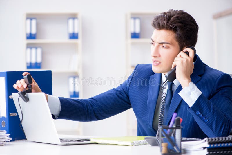 The Young Help Desk Operator Working in Office Stock Photo - Image of ...