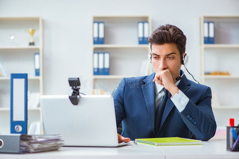The Young Help Desk Operator Working in Office Stock Photo - Image of ...