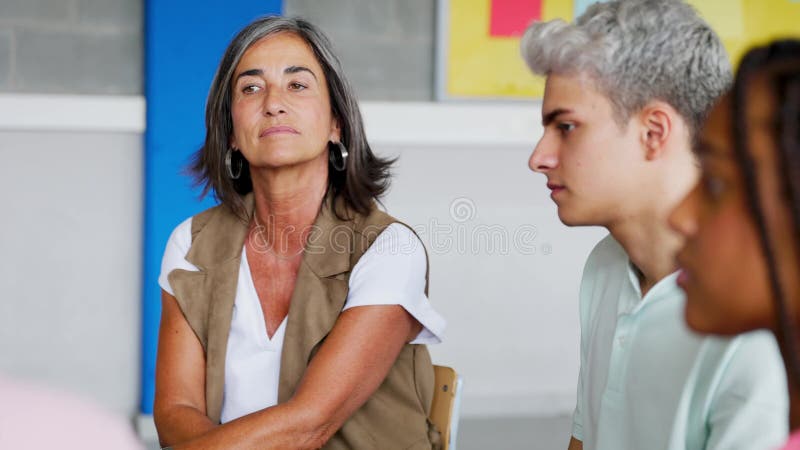 Young High School Students Talking with Teacher in Focus Group Therapy ...