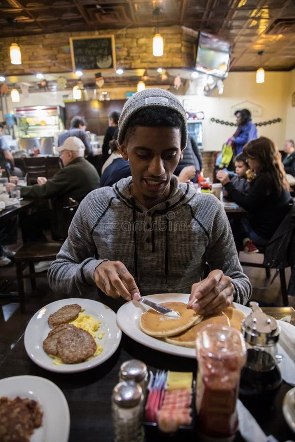 A Young, Hip Man Eats Brunch at Brooklyn, NYC Diner Stock Image - Image ...