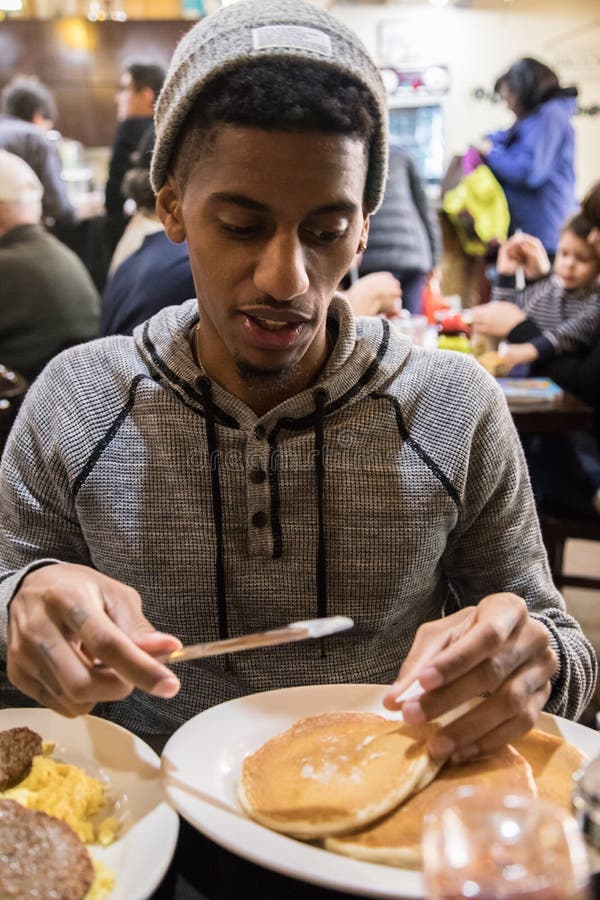 A Young, Hip Man Eats Brunch at Brooklyn, NYC Diner Editorial Photo ...