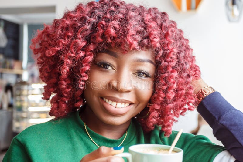 Young Hipster Dark Skinned Woman Dressed In Casual Clothes Holding Cup