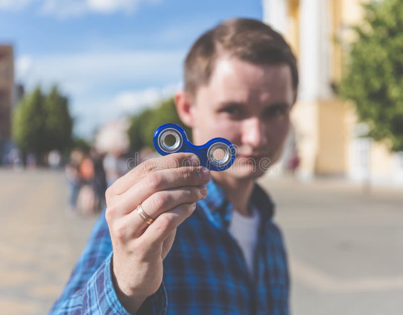 Young Hipster Man Showing To Camera Fidget Spinner Stock Image - Image ...