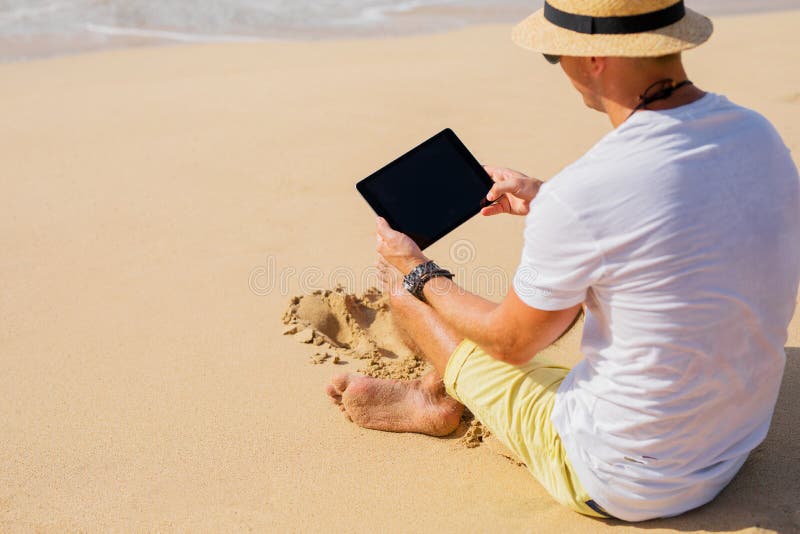 Young Man Using Tablet on the Beach Stock Image - Image of connection ...