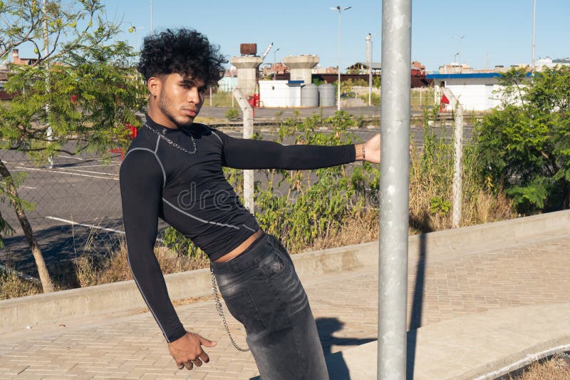 Young Hispanic African Man with a Serious Expression Holding on To a ...