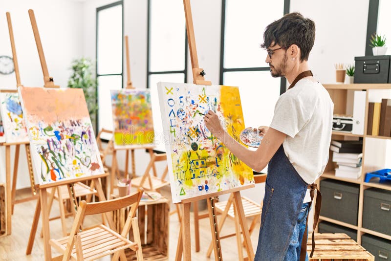 Young Hispanic Artist Man Concentrate Drawing at Art Studio Stock Image ...