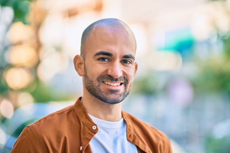 Young Hispanic Bald Man Smiling Happy Standing at the City Stock Image ...
