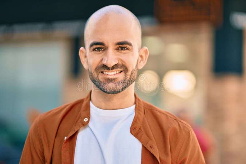 Young Hispanic Bald Man Smiling Happy Standing at the City Stock Image ...