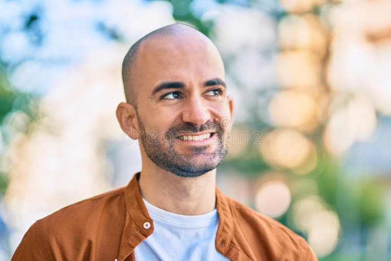 Young Hispanic Bald Man Smiling Happy Standing at the City Stock Image ...