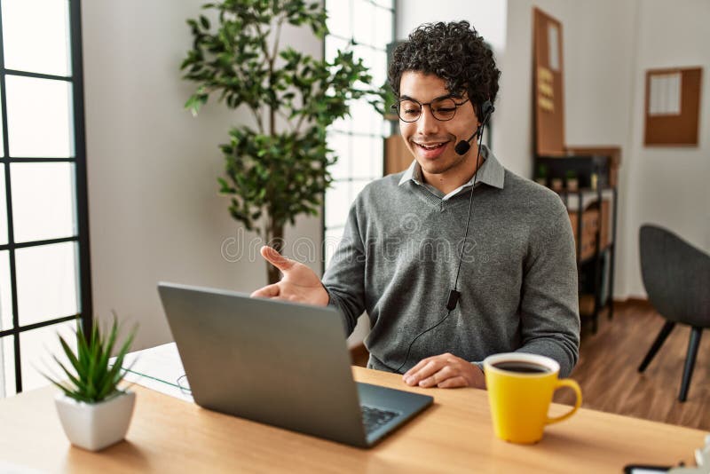 Young Hispanic Call Center Agent Man Having Video Call at the Office ...