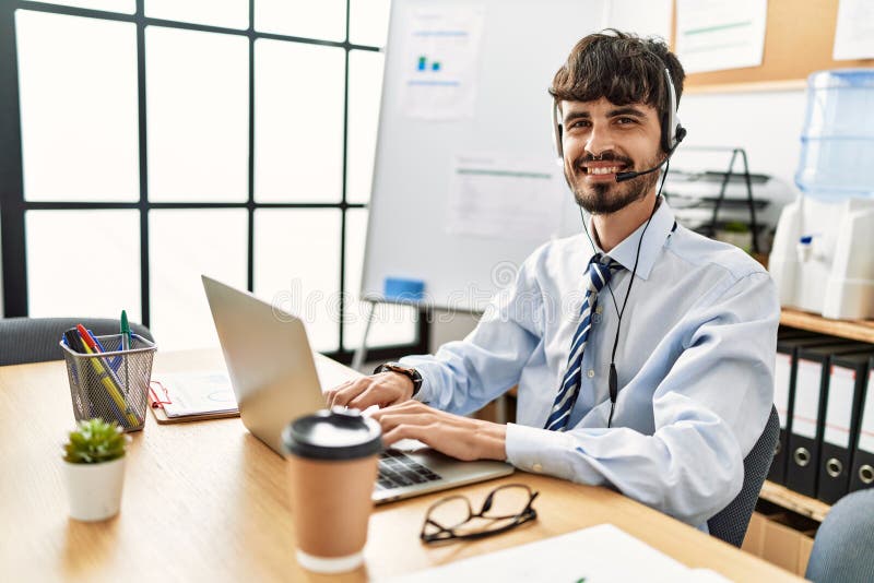 Young Hispanic Call Center Agent Man Smiling Happy Working at the ...