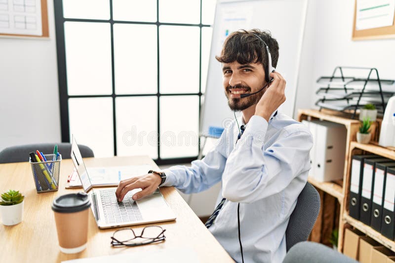 Young Hispanic Call Center Agent Man Smiling Happy Working at the ...