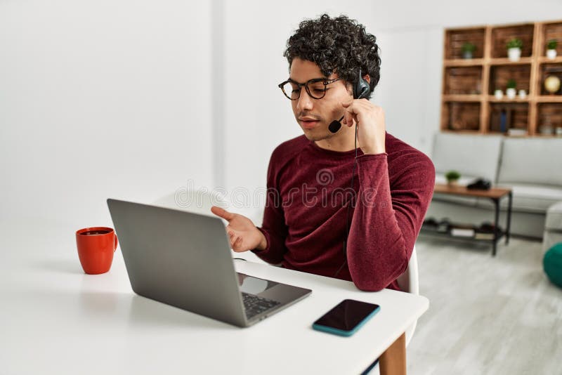 Young Hispanic Call Center Agent Man Working at Home Stock Image ...