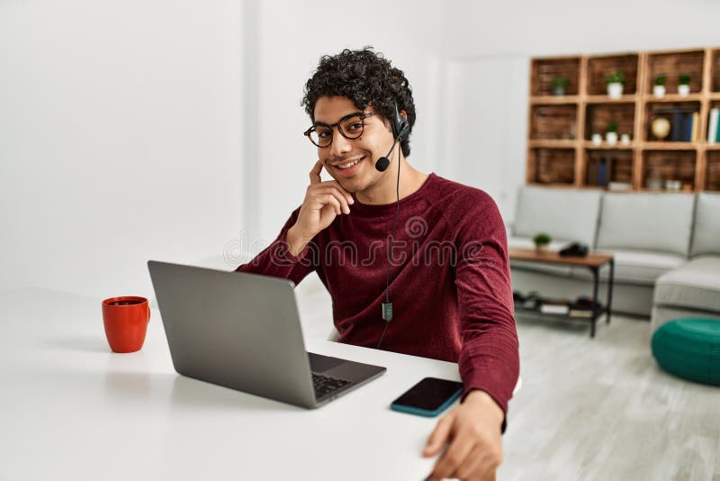 Young Hispanic Call Center Agent Man Working at Home Stock Photo ...
