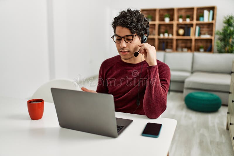 Young Hispanic Call Center Agent Man Working at Home Stock Image ...