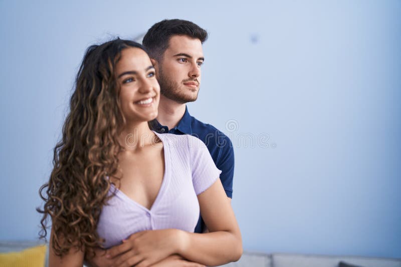 Young Hispanic Couple Hugging Each Other Standing at Home Stock Photo ... Young Hispanic Couple Hugging Each Other Standing at Home Stock Photo ...