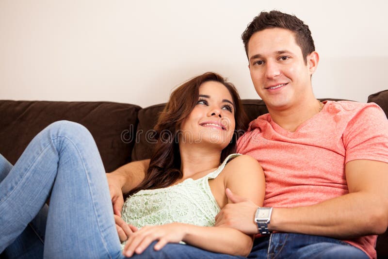 Young Hispanic Couple in Love Stock Photo - Image of date, couch: 33776068