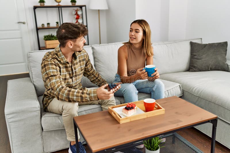 Young Hispanic Couple Smiling Happy Having Breakfast Sitting on the ...