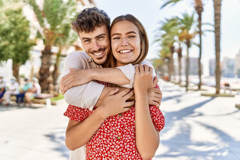 Young Hispanic Couple Smiling Happy and Hugging Standing at the City ...