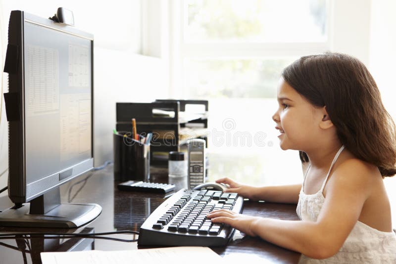 Young Hispanic Girl Using Computer at Home Stock Image - Image of ...