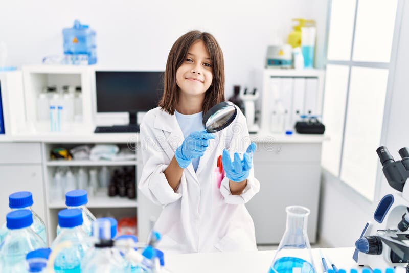 Young Hispanic Girl Using Loupe at Laboratory Stock Image - Image of ...