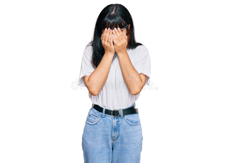 Young Hispanic Girl Wearing Casual Clothes With Sad Expression Covering