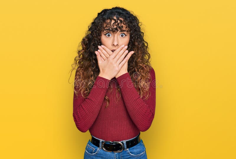 Young Hispanic Girl Wearing Casual Clothes Shocked Covering Mouth With
