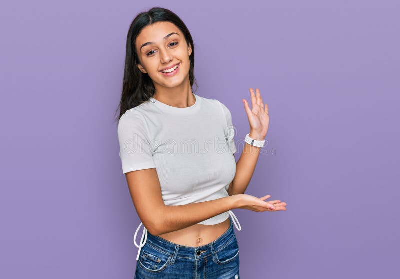 Young Hispanic Girl Wearing Casual White T Shirt Laughing At You