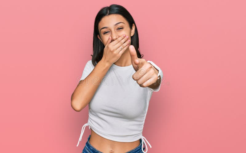 Young Hispanic Girl Wearing Casual White T Shirt Laughing At You