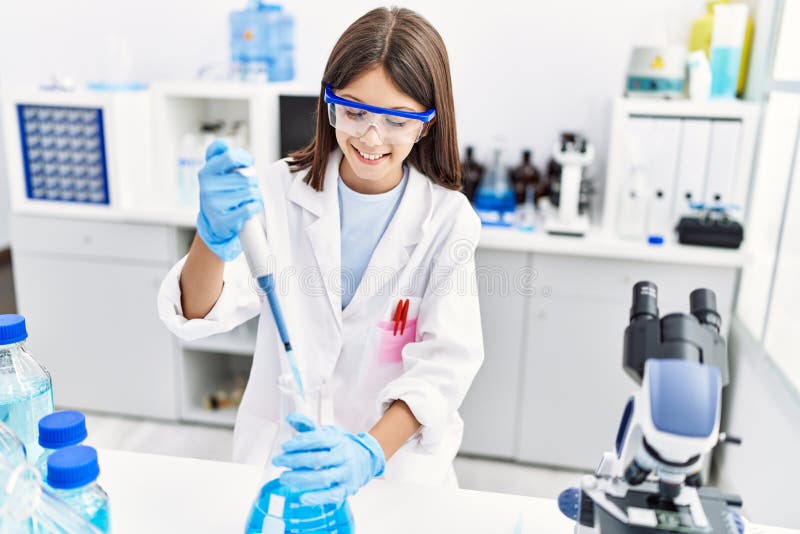 Young Hispanic Girl Working Using Pipette at Laboratory Stock Image ...