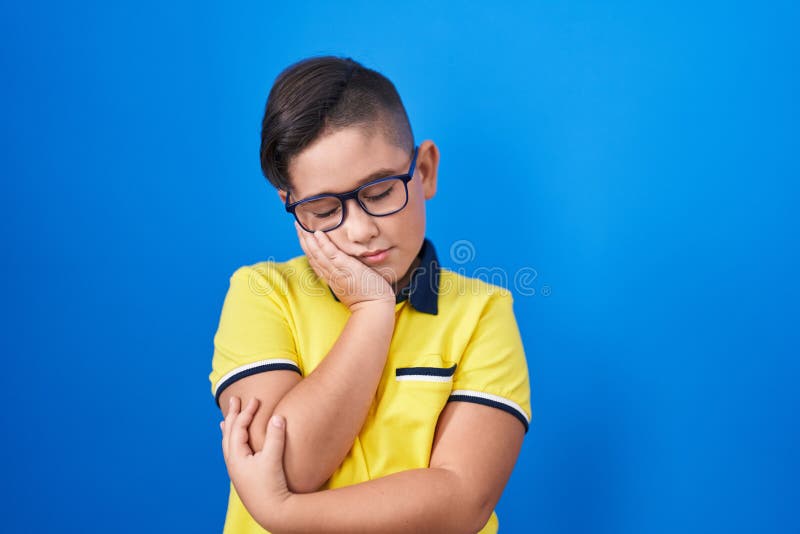Young Hispanic Kid Standing Over Blue Background Thinking Looking Tired ...