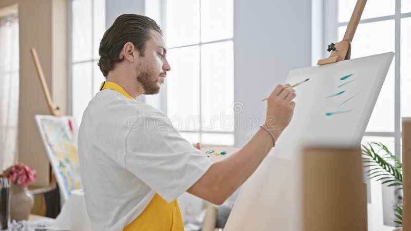 Young Hispanic Man Artist Drawing Concentrated at Art Studio Stock ...