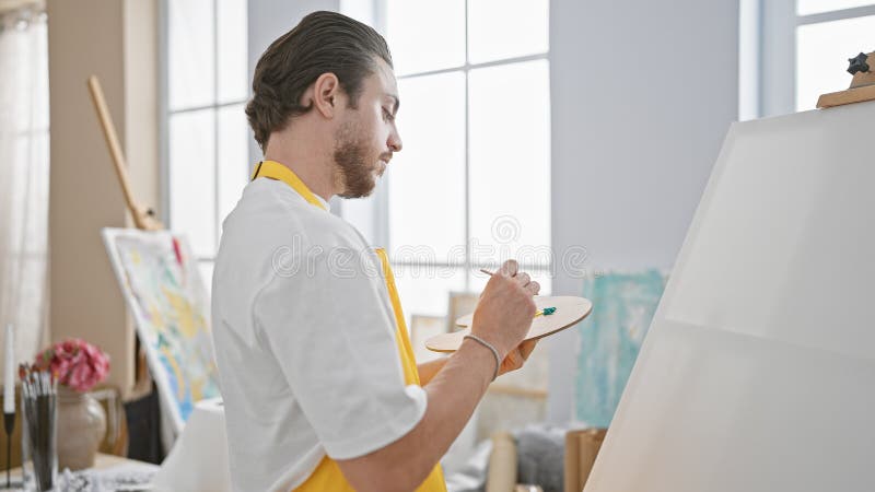 Young Hispanic Man Artist Drawing Concentrated at Art Studio Stock ...