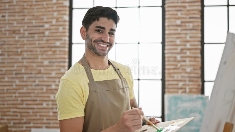 Young Hispanic Man Artist Smiling Confident Drawing at Art Studio Stock ...