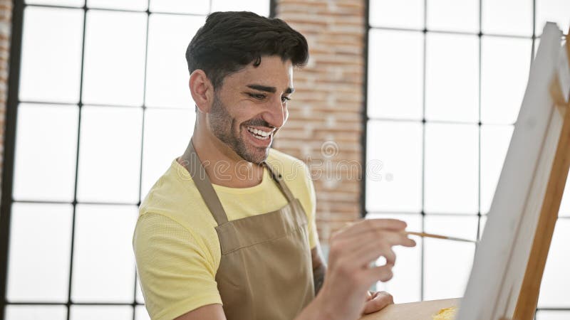 Young Hispanic Man Artist Smiling Confident Drawing at Art Studio Stock ...