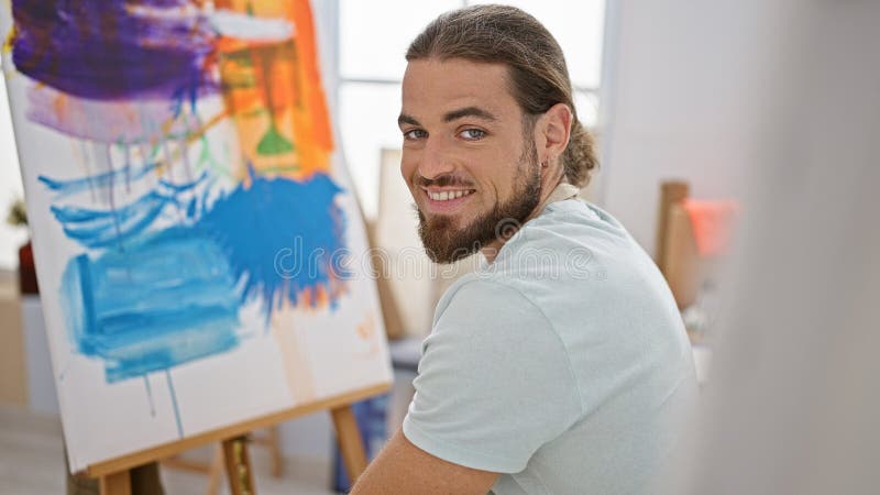 Young Hispanic Man Artist Smiling Confident Drawing at Art Studio Stock ...