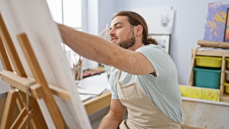 Young Hispanic Man Artist Smiling Confident Drawing at Art Studio Stock ...