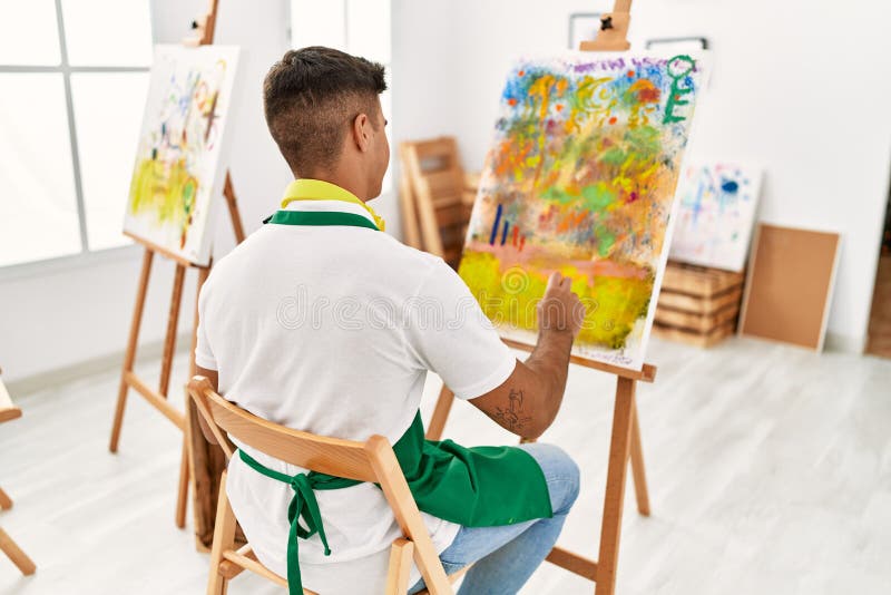Young Hispanic Man on Back View Drawing at Art Studio Stock Photo ...