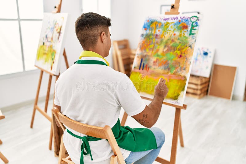 Young Hispanic Man on Back View Drawing at Art Studio Stock Photo ...