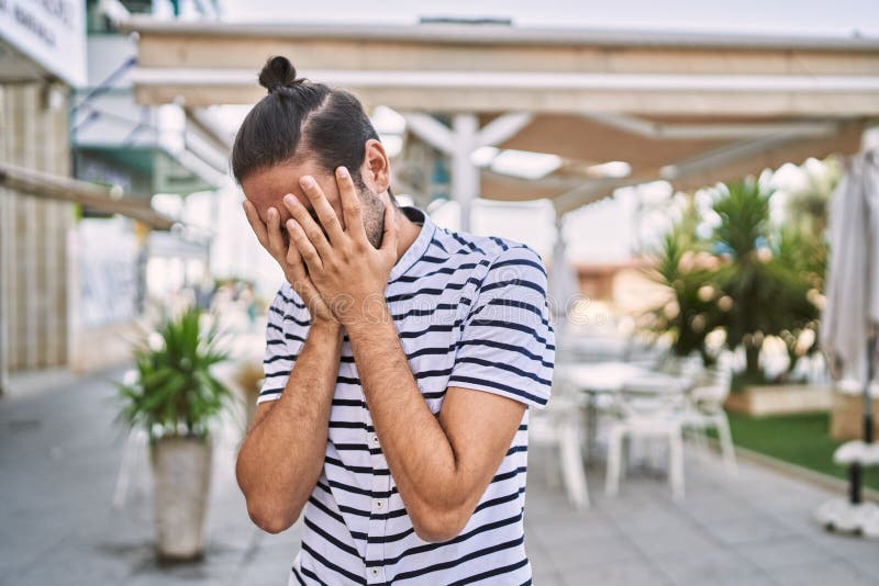 Young Hispanic Man with Beard Outdoors at the City with Sad Expression ...